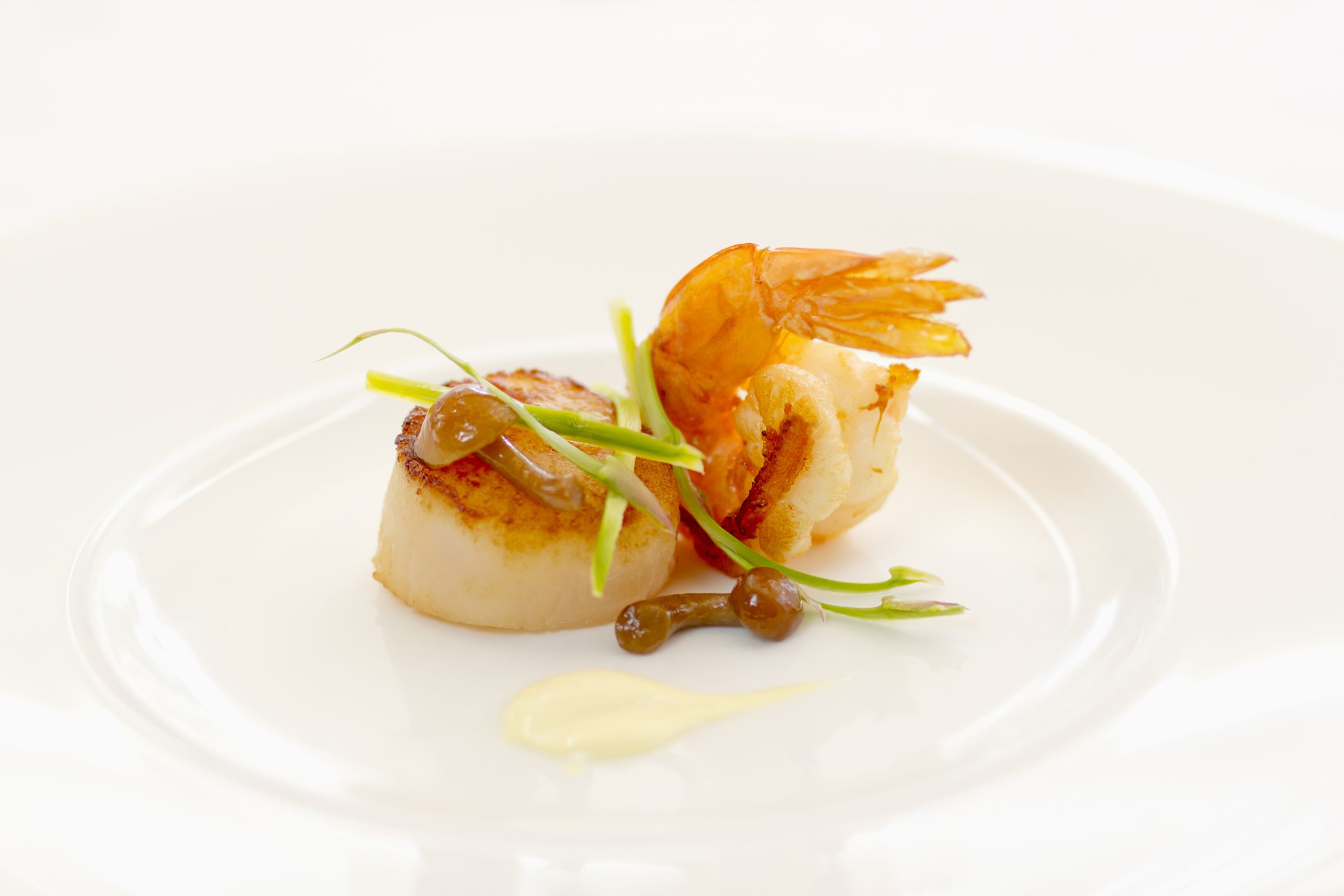 Are scallops high in cholesterol like shrimp?