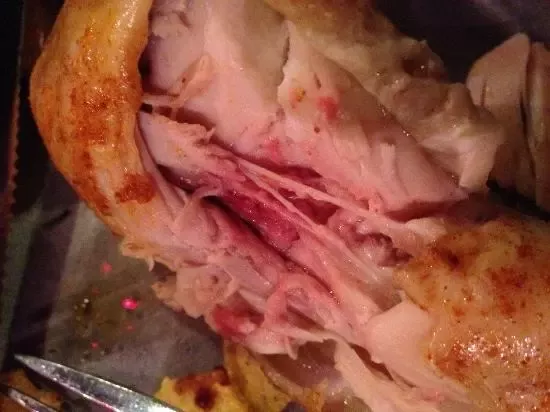 Can a few bites of undercooked chicken make you sick?