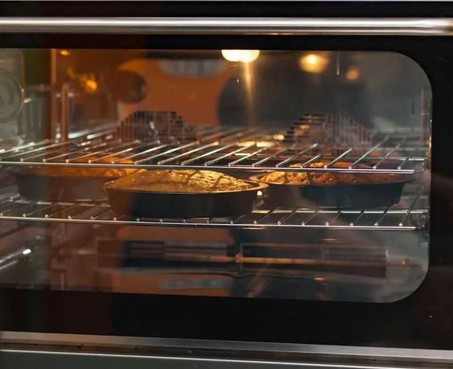 Can you bake a cake with other food in the oven?
