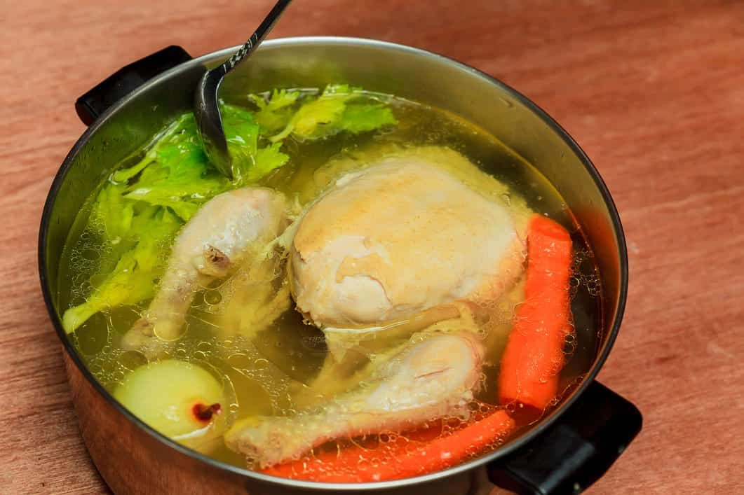 Can you boil a whole frozen chicken for soup?