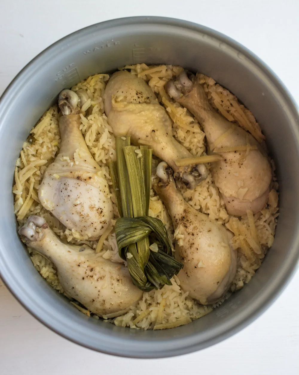 Can you cook raw chicken in rice cooker with rice?