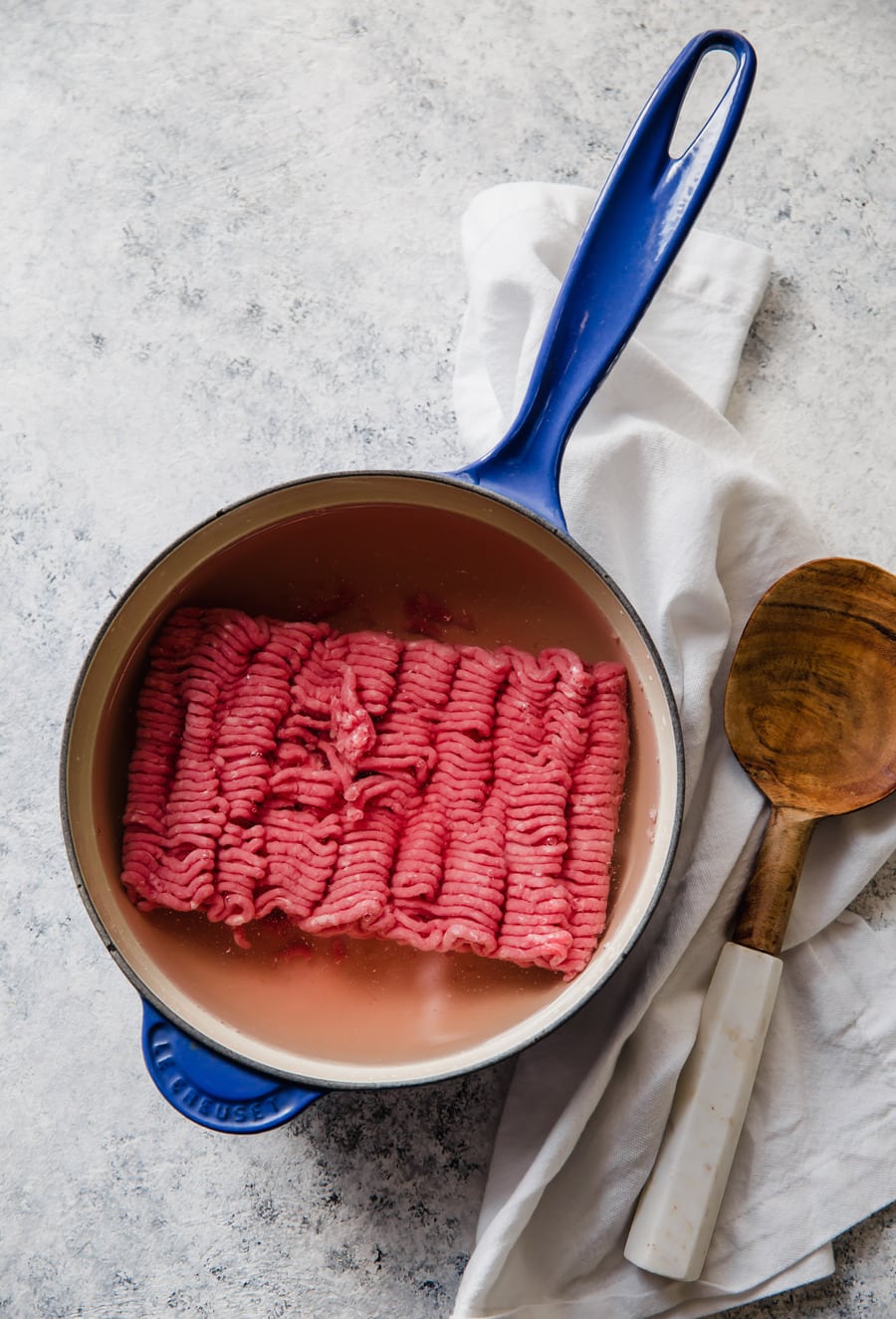Can you cook raw ground beef in sauce?