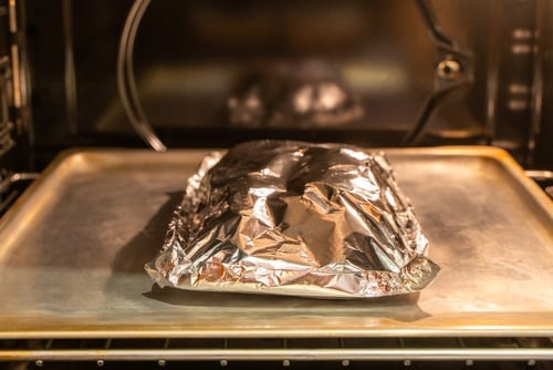 Can you cover food with aluminum foil in the oven?