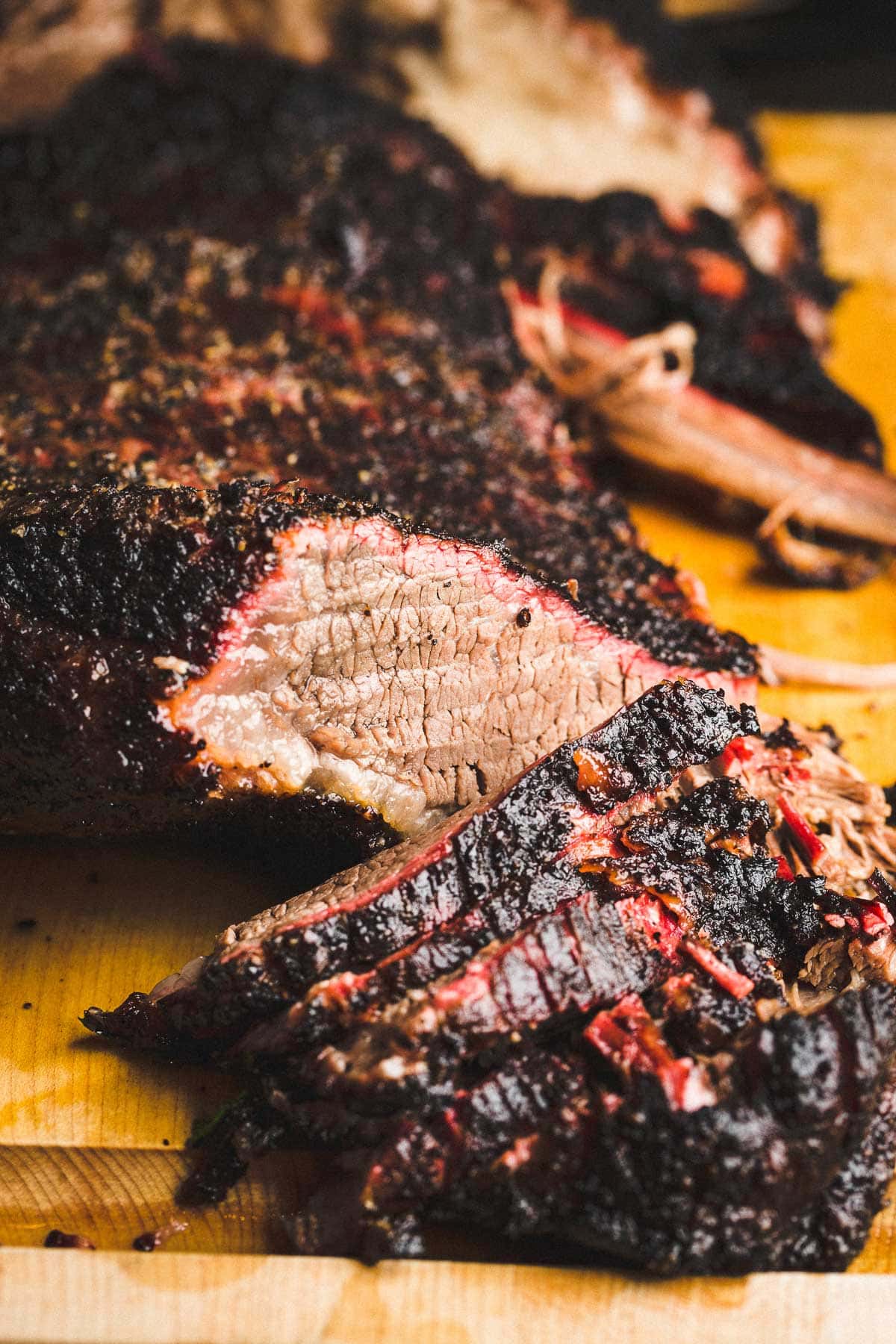 Can you smoke a cooked brisket?