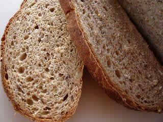 Can you tell if bread is whole grain if it has a brown color?