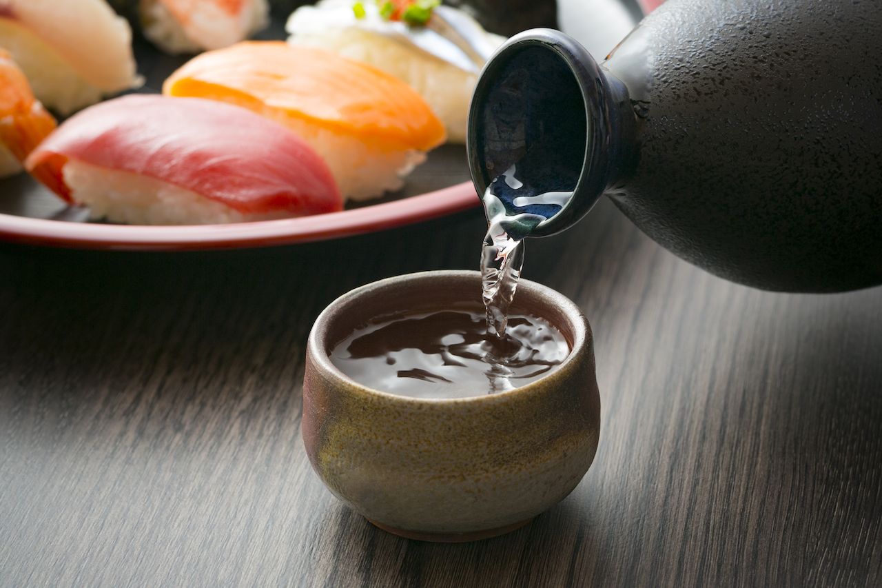 Do Japanese drink sake with food?