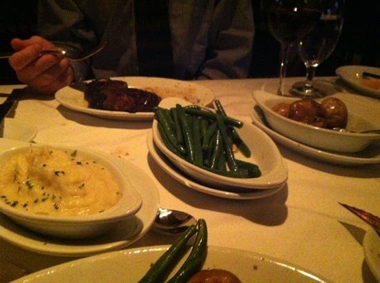 Do sides come with steak at Ruth's Chris?