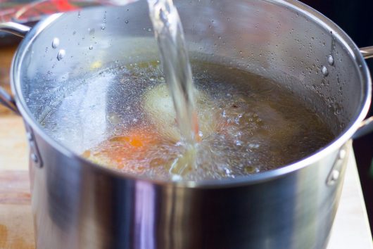 Do you add stock to boiling water?