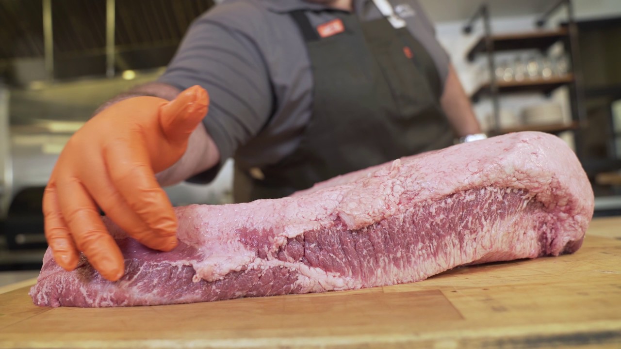 Do you cook brisket fat side up or down on a pellet grill?