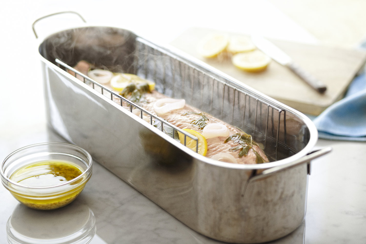 Do you cover the pan when poaching fish?