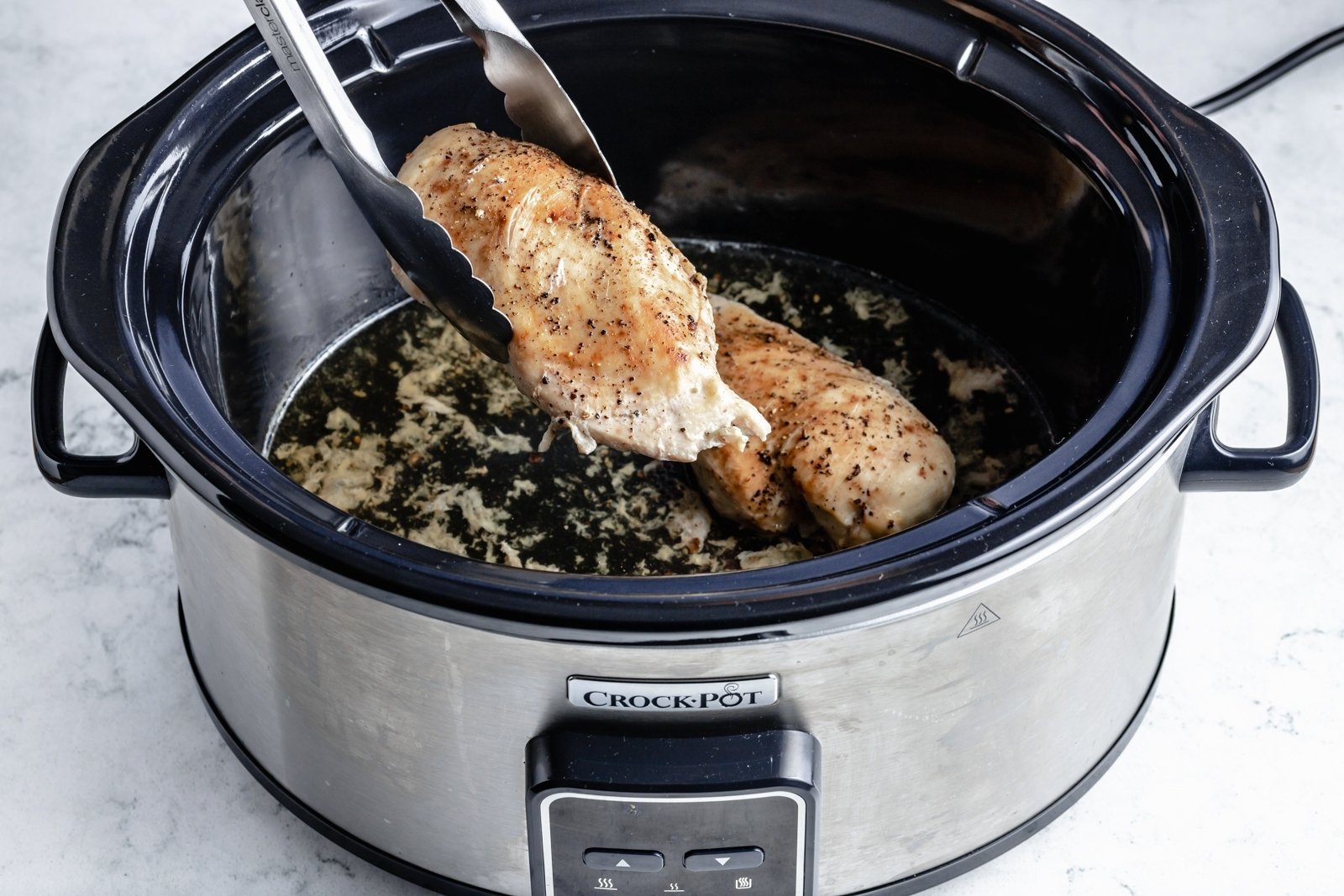 Do you have to put water in the crock pot with chicken?