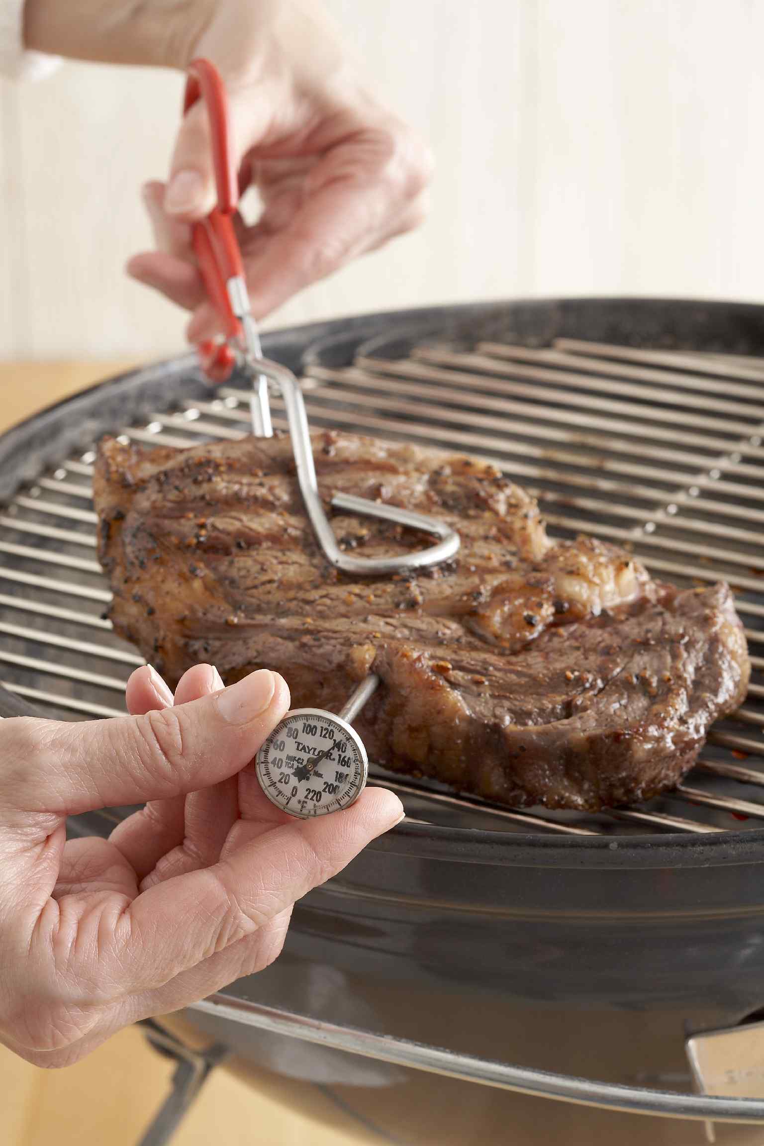 Do you leave meat thermometer in while grilling?