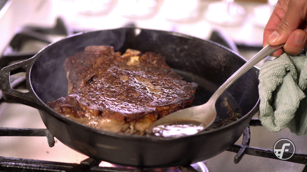 Do you put butter in pan when cooking steak?