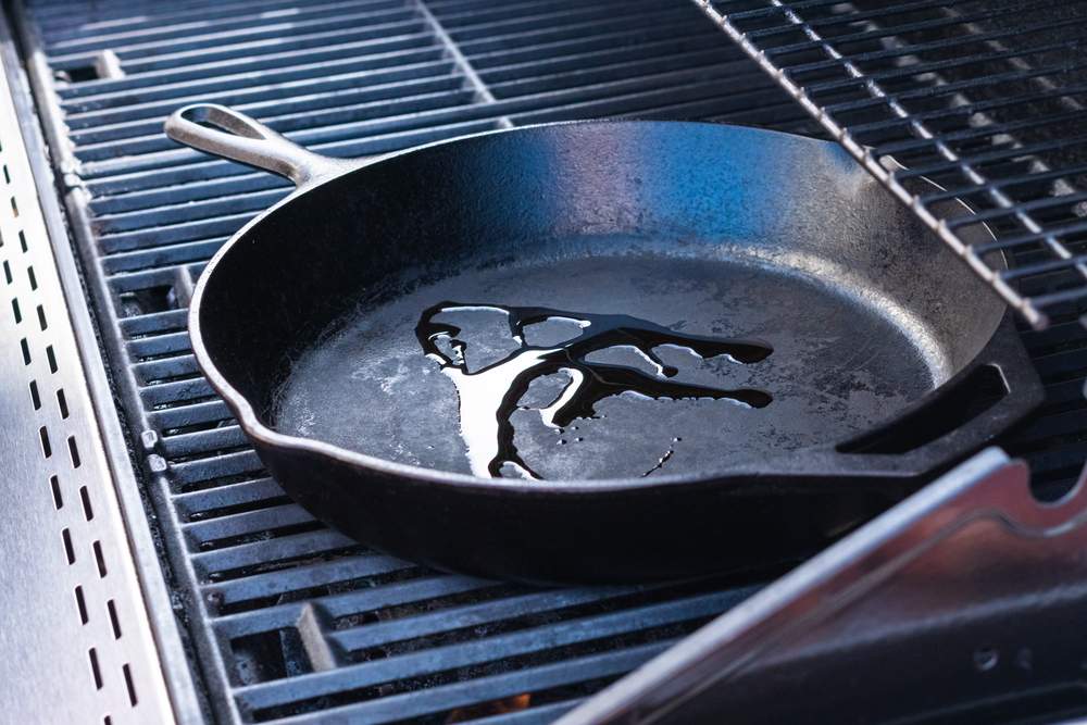 Do you put oil in cast iron before cooking?
