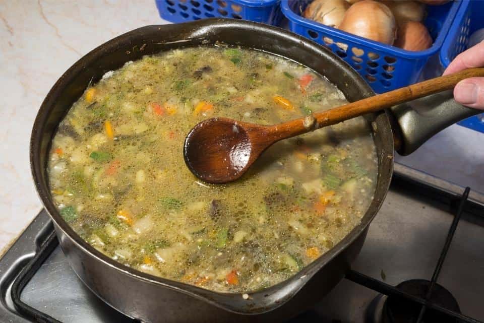 Do you simmer soup uncovered or covered?