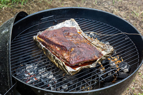 Do you smoke a brisket on the grill or in a pan?