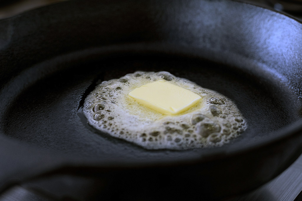 Do you use oil or butter in a cast iron skillet?