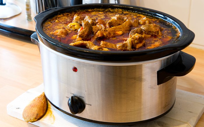 Does meat go on bottom of slow cooker?