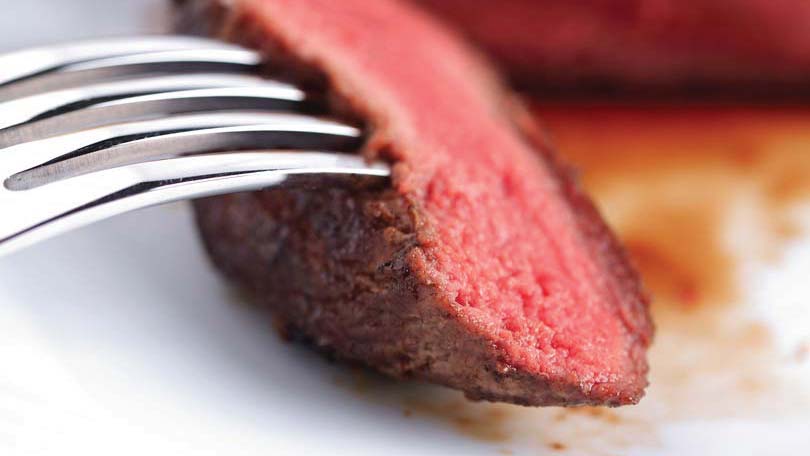 Does medium rare steak have parasites?