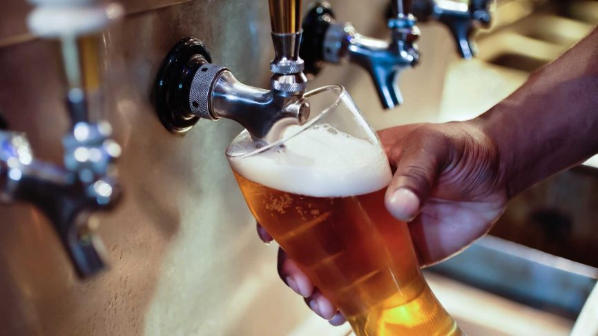 Does pouring beer into a glass help with bloating?