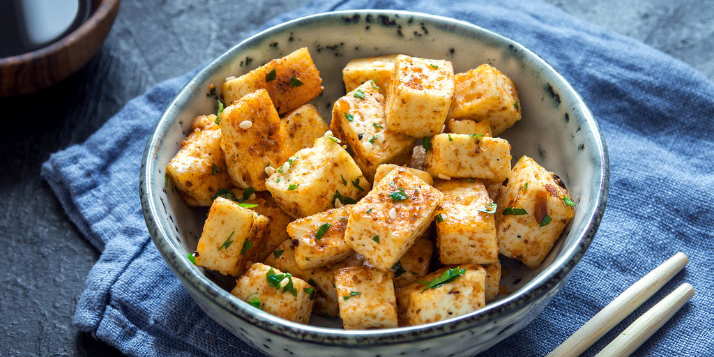 Does tofu taste like what you cook it with?