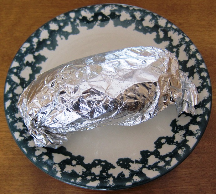 Does wrapping a potato in foil make it cook faster?