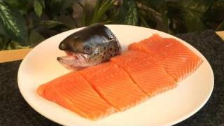 How are salmon fillets deboned?
