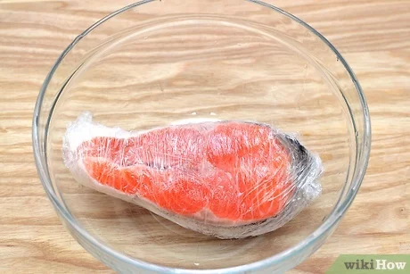 How can I speed up defrosting salmon?