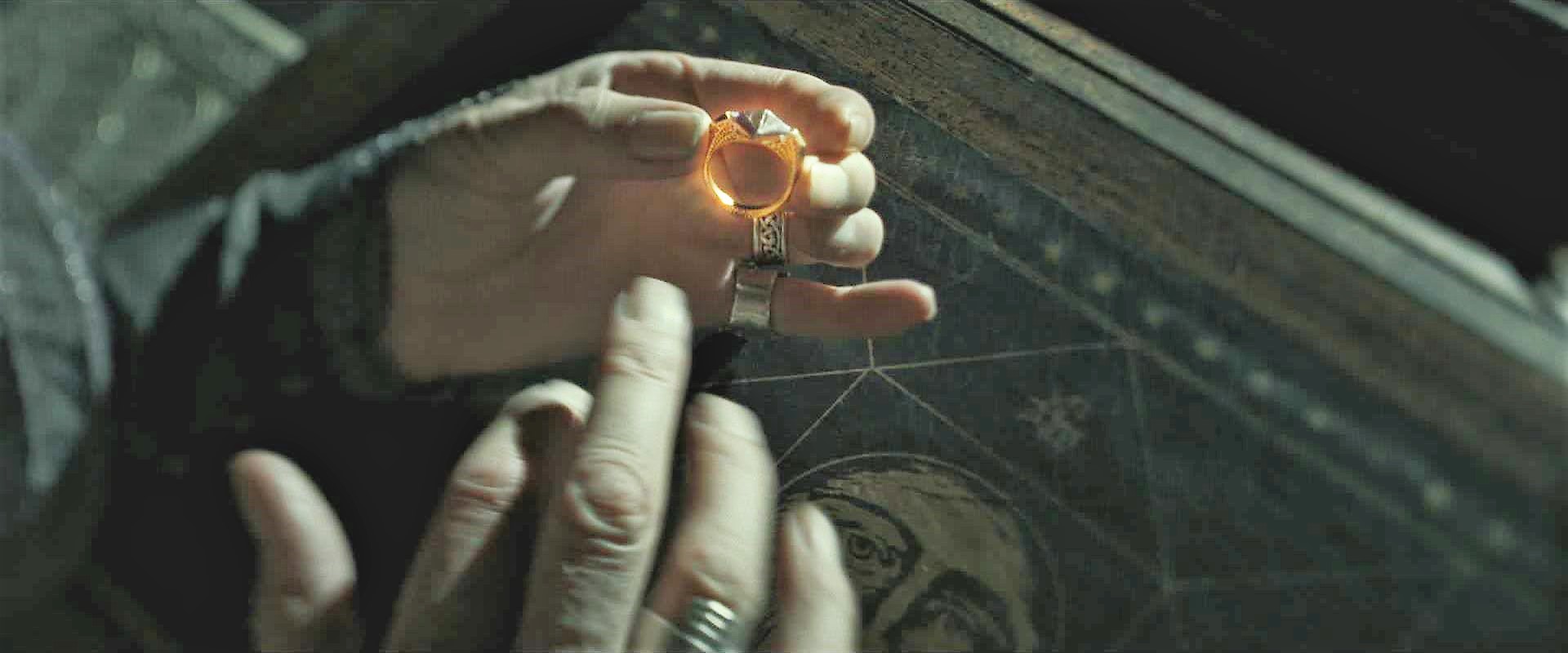 How did Dumbledore destroy the ring in the movie?