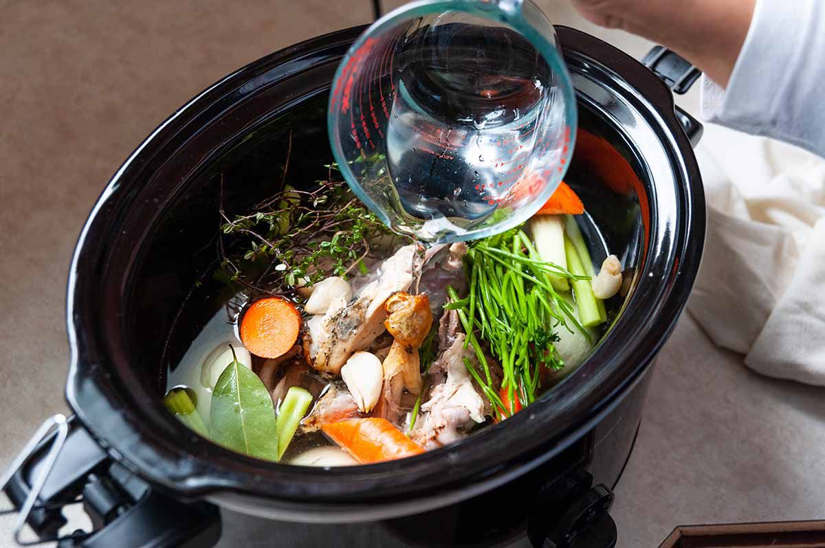 How do I add stock to a slow cooker?