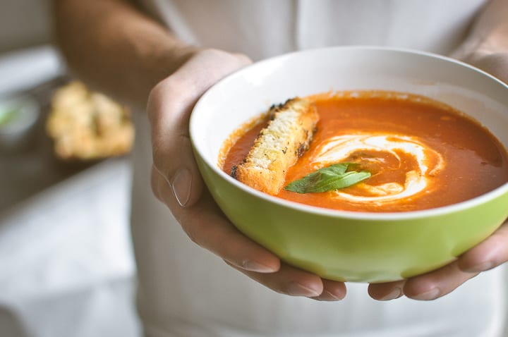 How do I make my tomato soup less acidic?