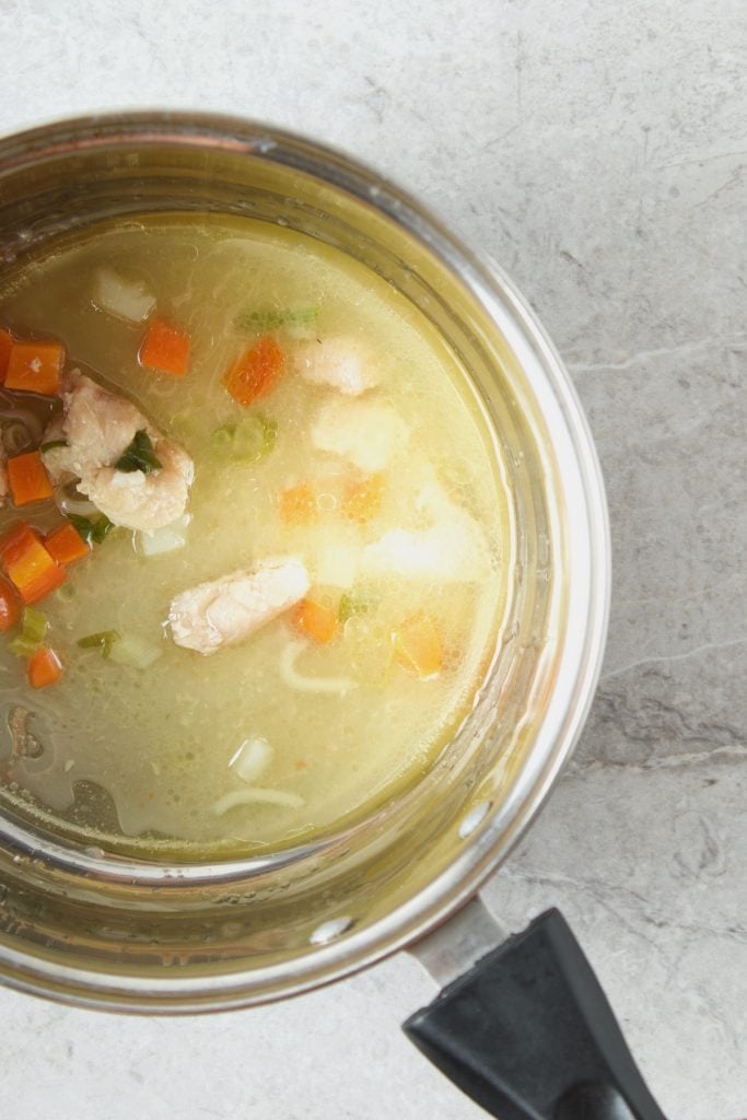 How do I reheat chicken soup?