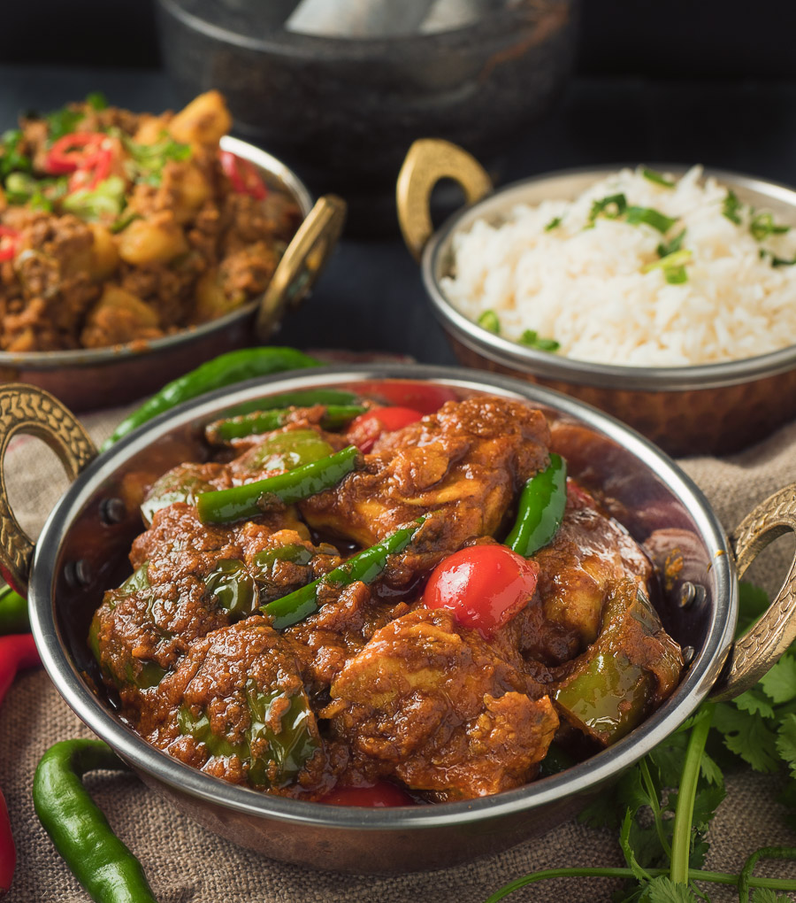 How do Indian restaurants make curries?