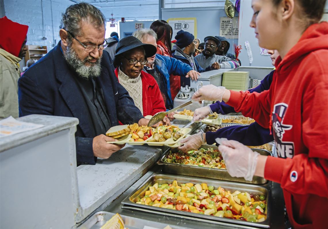 How do soup kitchens feed the poor and homeless?