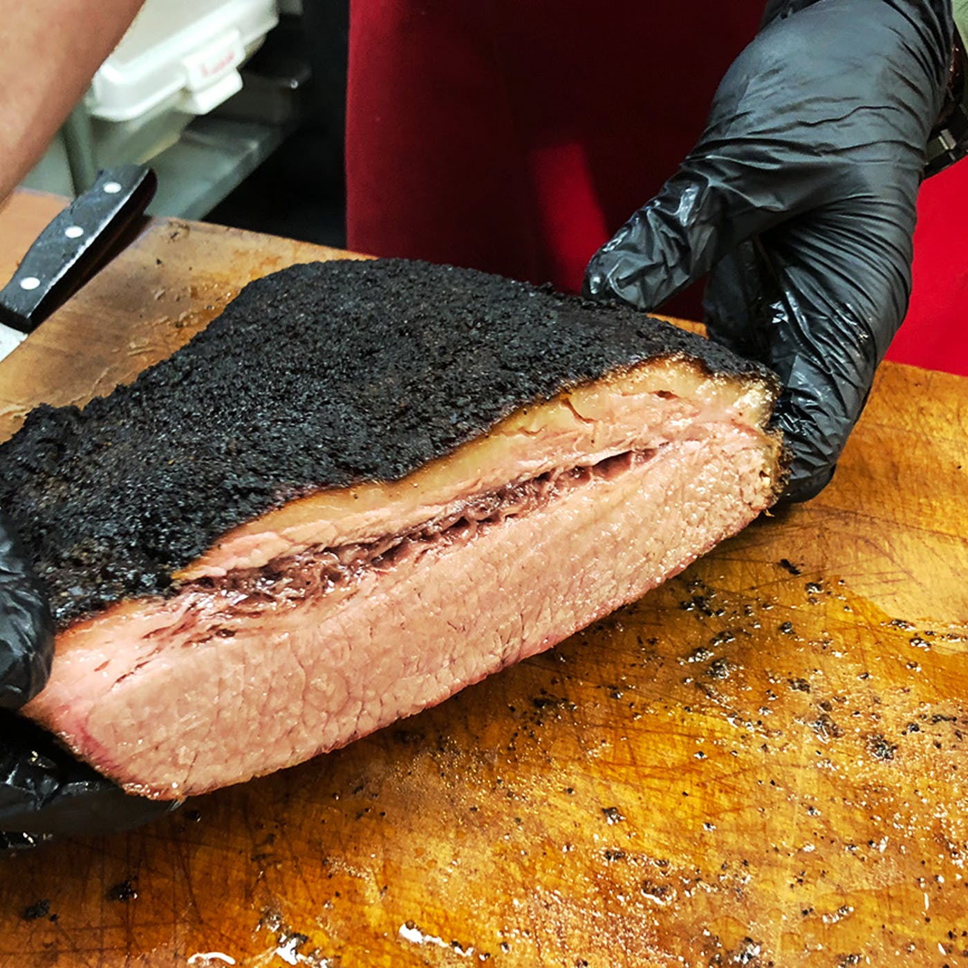 How do you add moisture to a brisket before cooking?