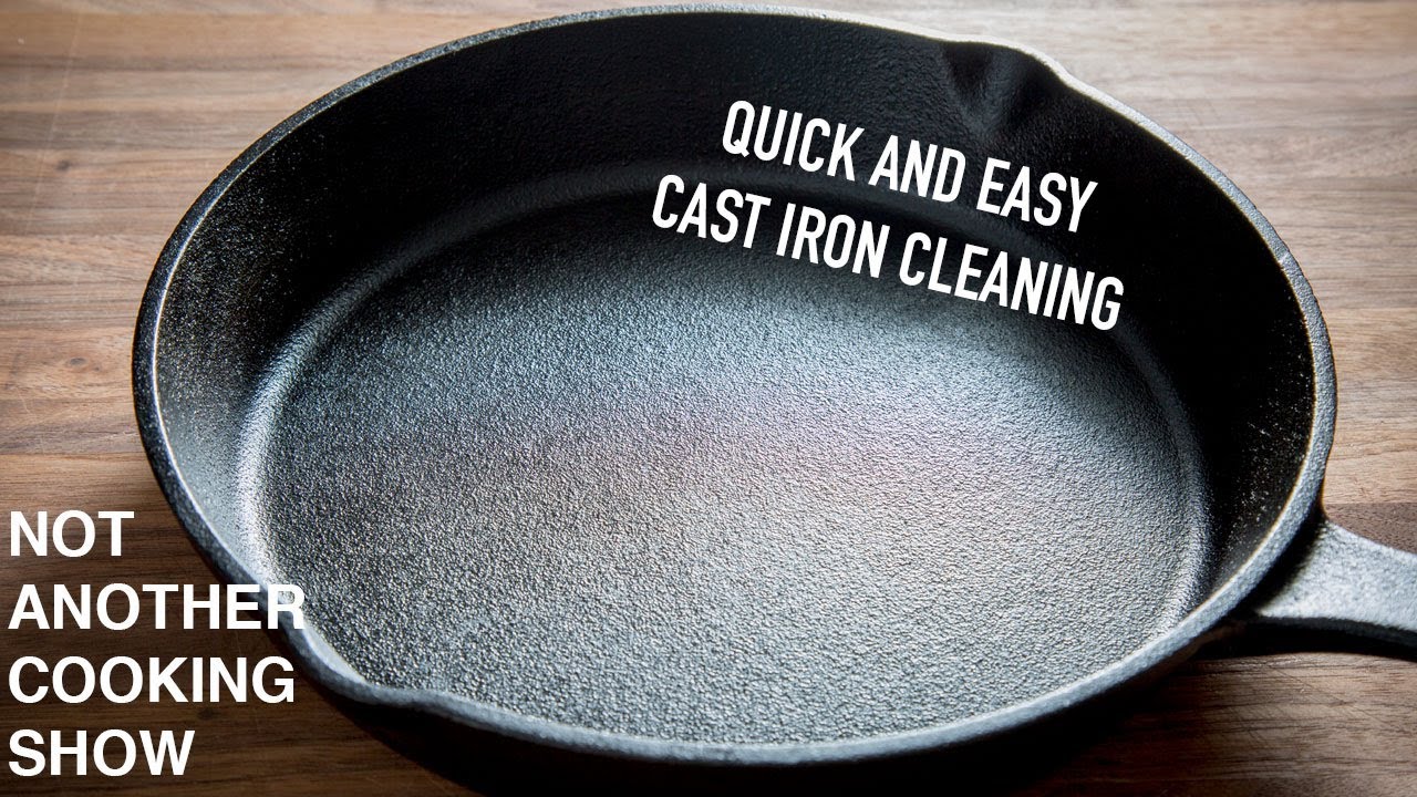 How do you clean a cast iron pan after cooking with oil?