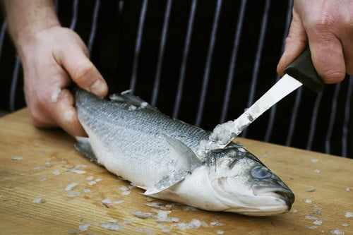 How do you clean and cook fish before cooking?
