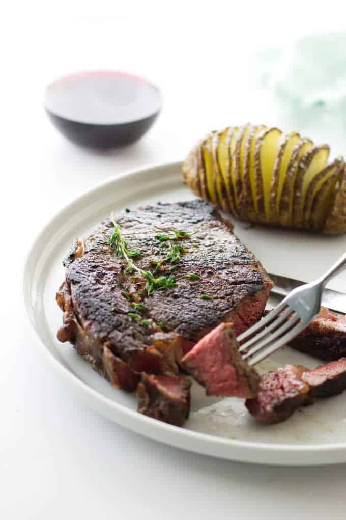 How do you cook a 3 inch thick ribeye steak in the oven?