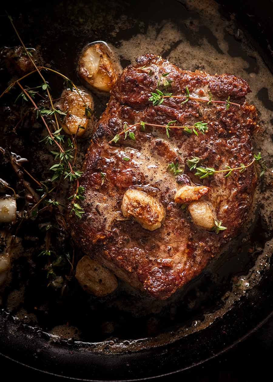 How do you cook a large steak?