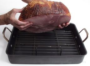 How do you cook a moist Ham in a roaster?