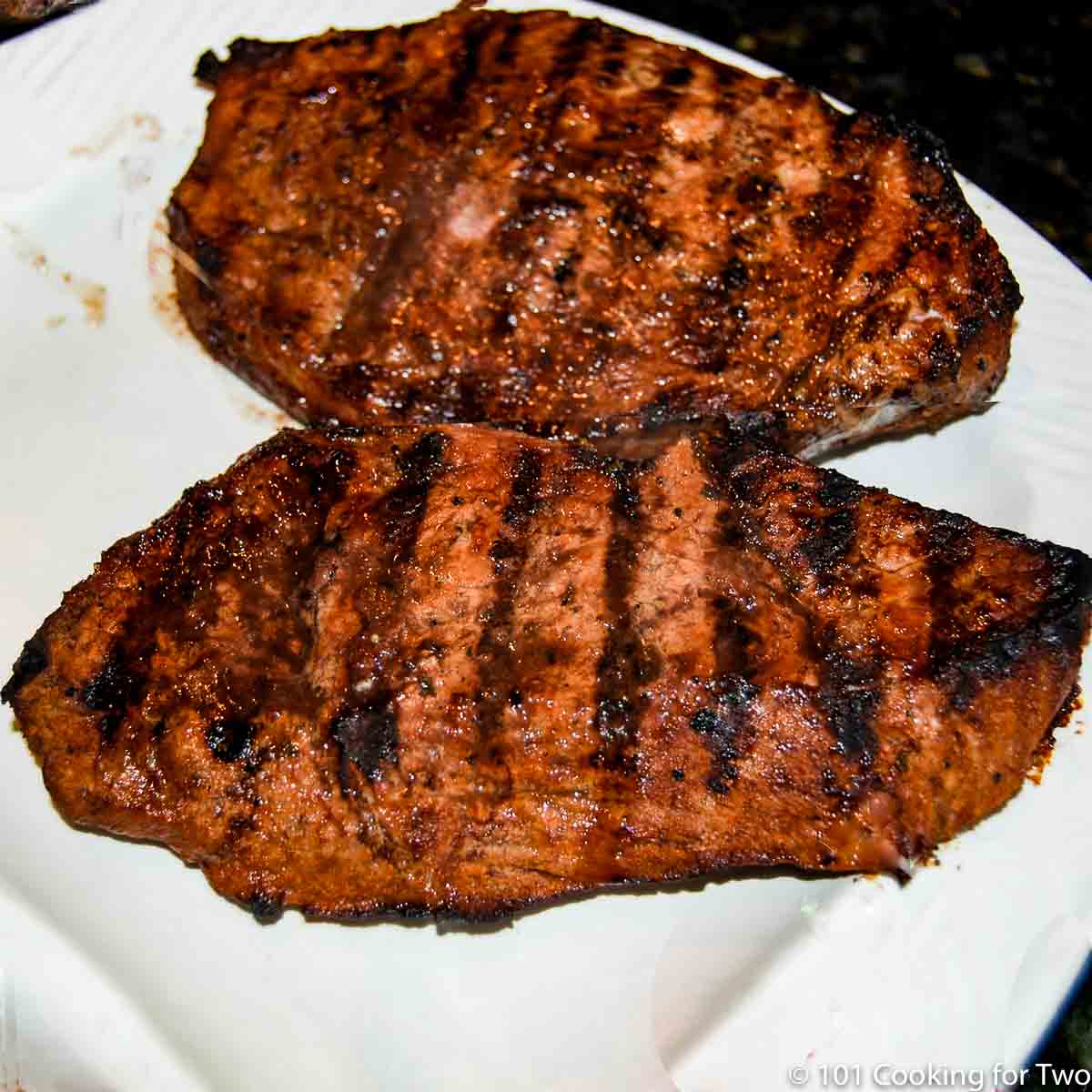 How do you cook a sirloin steak on a charcoal grill?