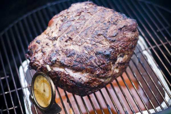 How do you cook a sirloin tip steak on a charcoal grill?
