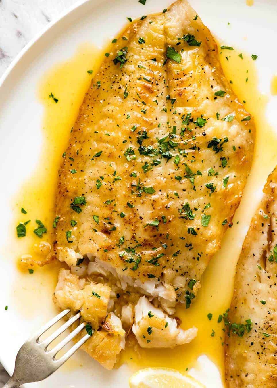 How do you cook fish in lemon butter sauce?