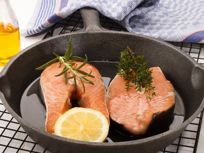 How do you cook fish on a cast iron skillet without it sticking?