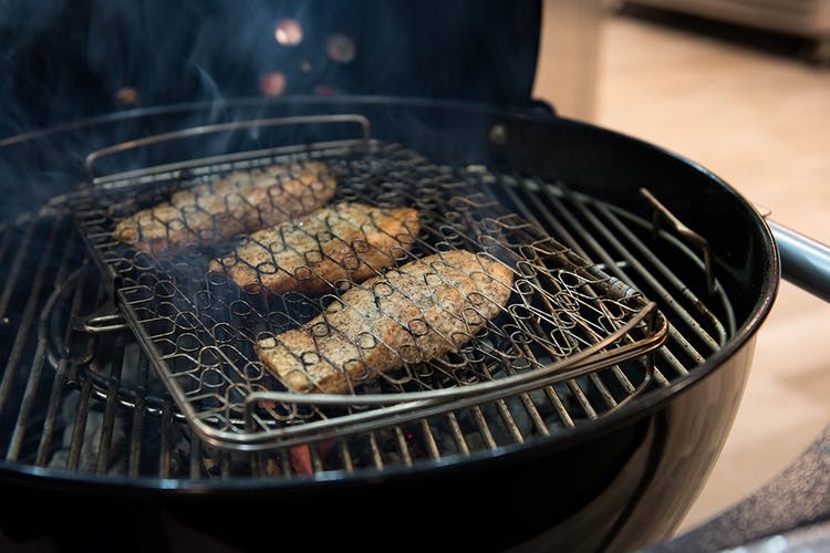 How do you cook fish on a Weber charcoal grill?