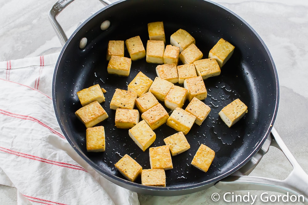 How do you cook tofu in a stainless steel pan?