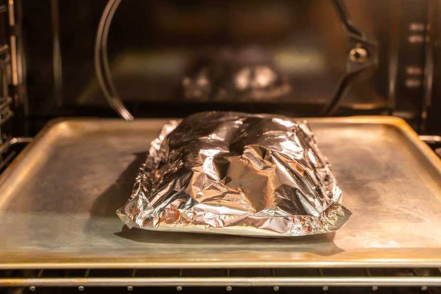 How do you cook with foil in the oven?