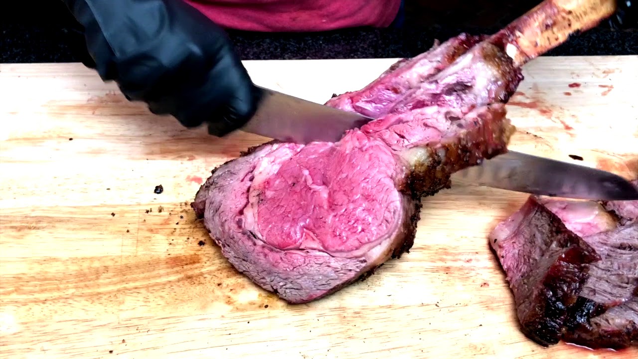 How do you cut Tomahawk steak after cooking?