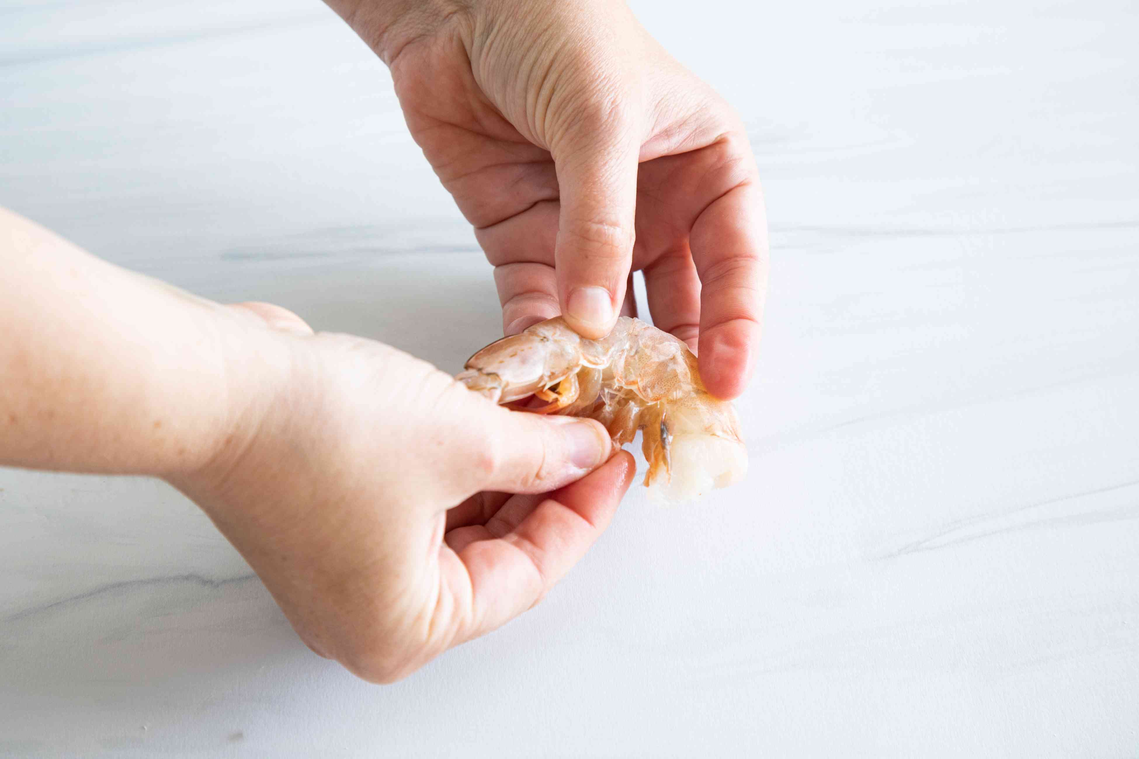How do you devein raw shrimp?