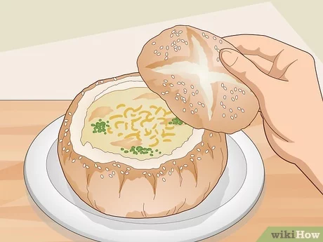 How do you eat a bun with soup?